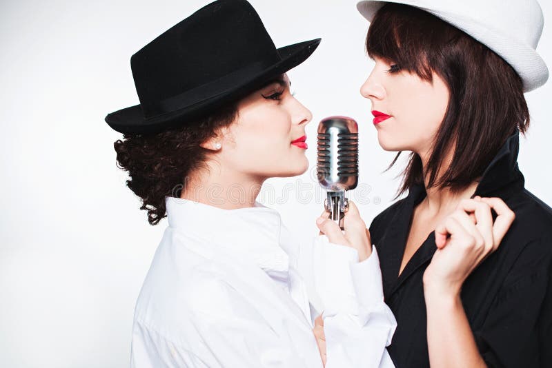Two People Singing To One Microphone Stock Photos - Free & Royalty-Free ...