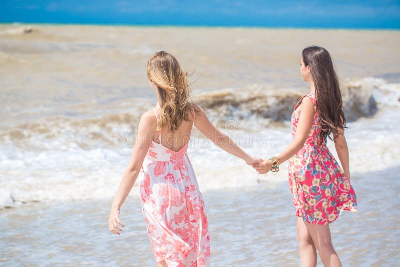 Two Girlfriend on the Beach Stock Photo - Image of relax, beauty: 61240480
