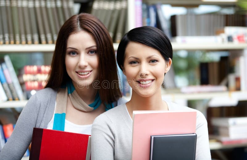 Two Girlfriends with Books at the Library Stock Image - Image of ...
