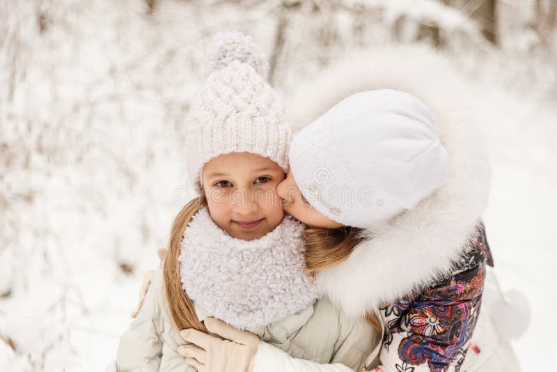 Two Girlfriends Playing in a Winter Forest. Stock Image - Image of cold ...