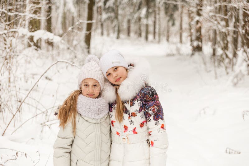 Two Girlfriends Playing in a Winter Forest. Stock Image - Image of ...