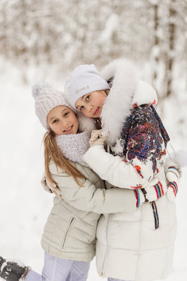 Two Girlfriends Playing in a Winter Forest. Stock Photo - Image of ...