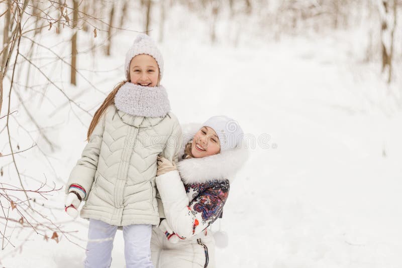 Two Girlfriends Playing in a Winter Forest. Stock Photo - Image of ...
