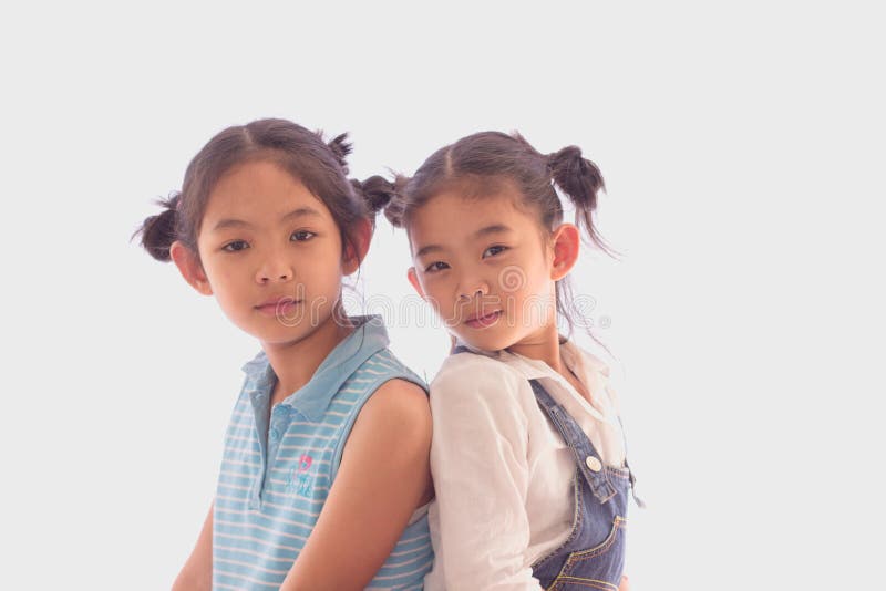 Two Girls Back Together on Whaite Background. Stock Photo - Image of ...