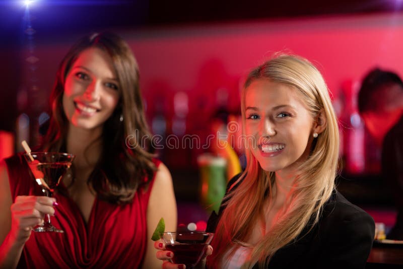 Two Girls at the Bar with Cocktail Drink Stock Photo - Image of cheers ...