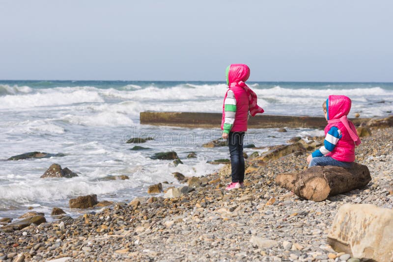 Two Girls on the Beach Looking into Distance Stock Image - Image of ...