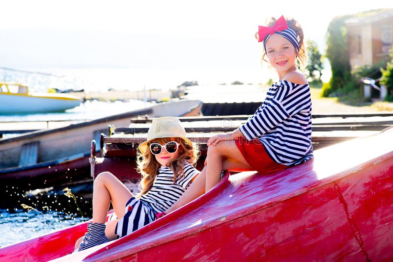 Two girls with the boat stock photo. Image of sailor - 78130328