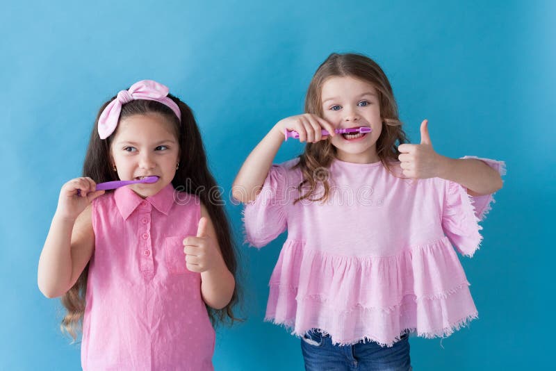 Two Little Girls Brush Their Teeth Brushed Stock Image - Image of ...