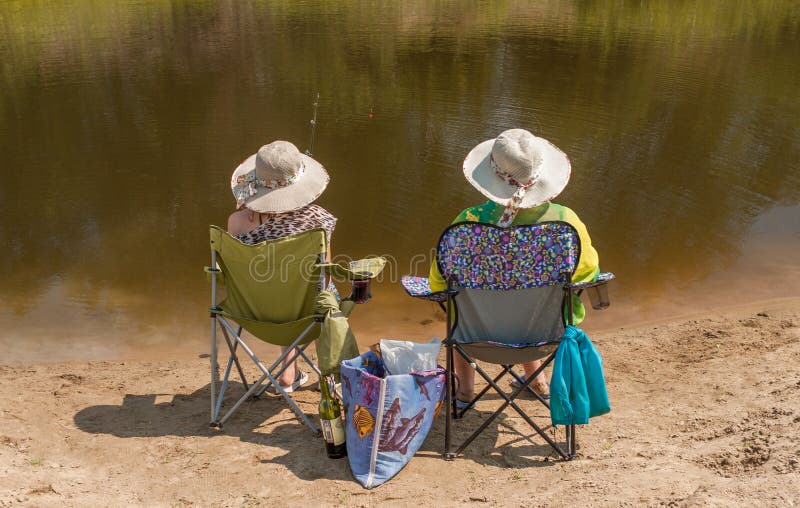 Two girls catch fish stock photo. Image of casting, fishing - 66087746