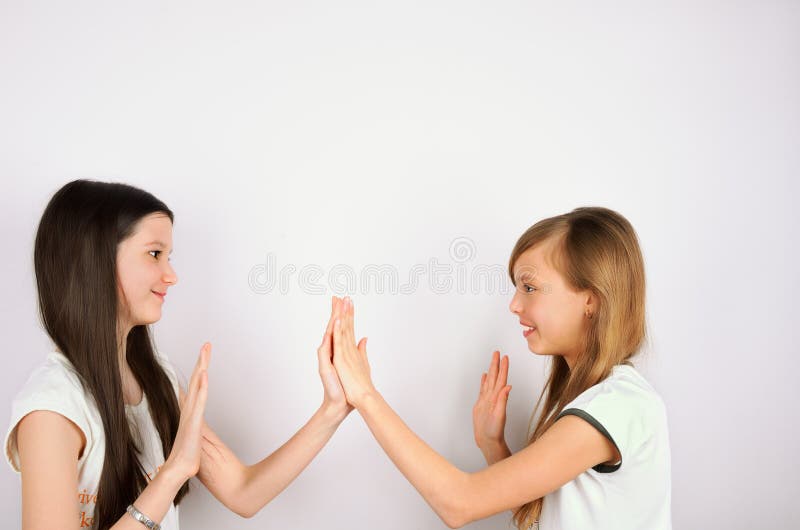Two girls claping palms stock photo. Image of child, expressing - 40069996