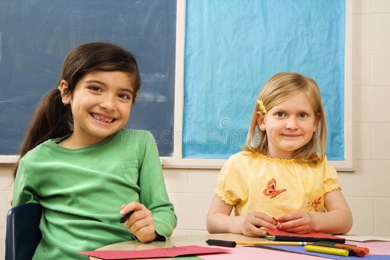 Two Girls in Classroom. stock image. Image of child, looking - 12529133