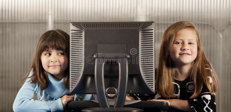 Two girls and a computer stock photo. Image of child, technology - 8629906