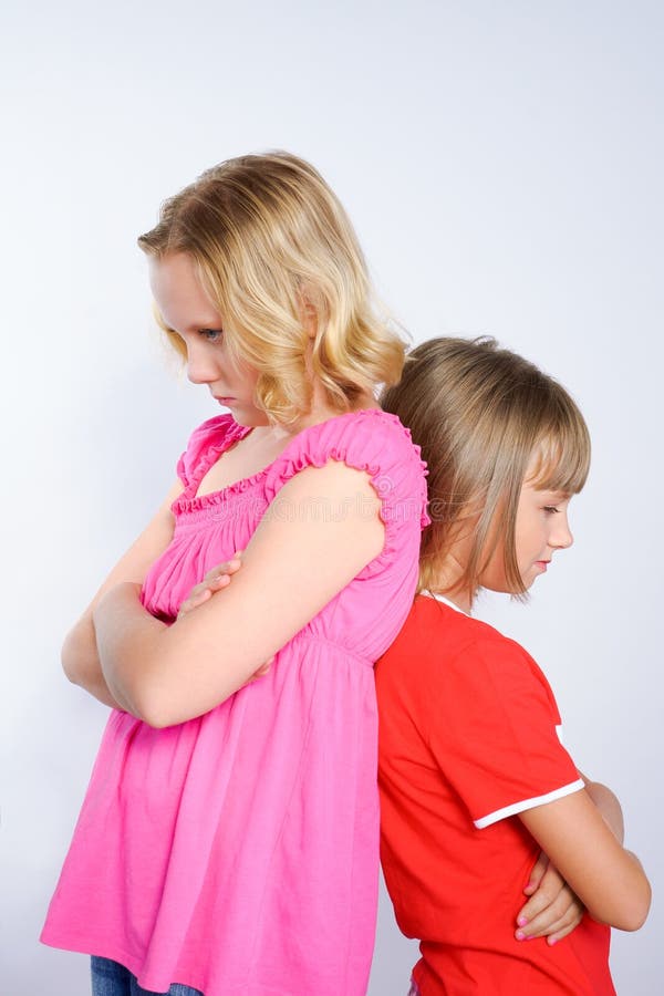 Two Girls in Conflict Standing Back To Back Stock Photo - Image of ...