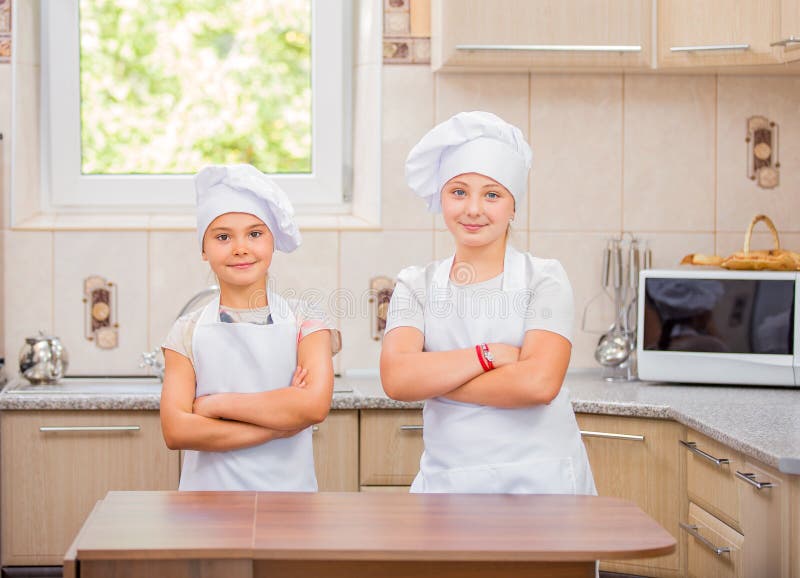 Two girls cook stock image. Image of brother, happy, food - 59255863
