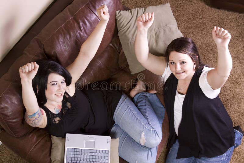 Two Girls Sitting On The Sofa Watching A Movie Stock Image Image Of