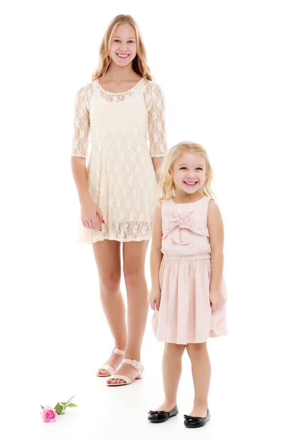 Two Girls of Different Ages in the Studio on a White Background. Stock ...