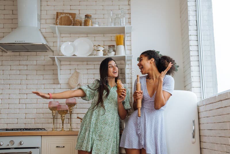 Two Girls of Different Races Having Fun in the Kitchen Stock Photo ...