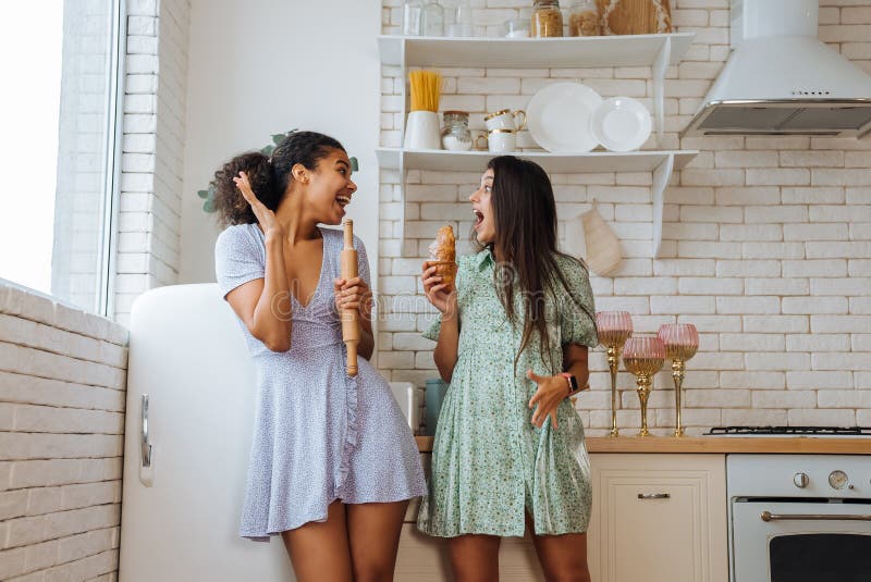 Two Girls of Different Races Having Fun in the Kitchen Stock Image ...