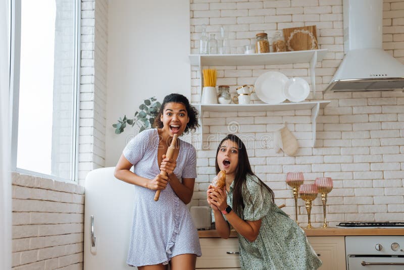 Two Girls of Different Races Having Fun in the Kitchen Stock Photo ...