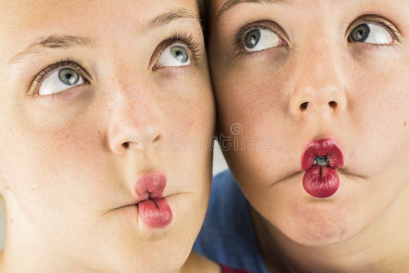 Two Girls Doing Fishlips stock image. Image of happy - 59055211