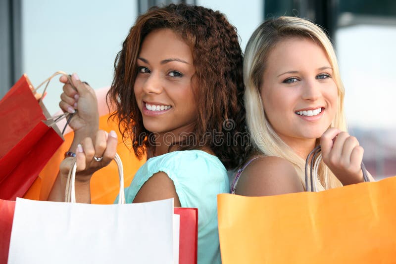 Two girls doing shopping stock photo. Image of beautiful - 35740100