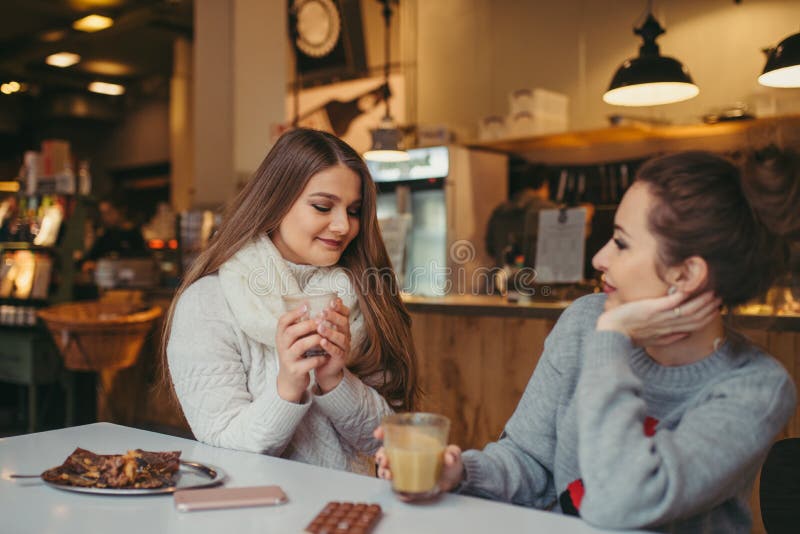 Two Girls Drinking Coffee in Cafe Stock Photo - Image of girl, cafe ...