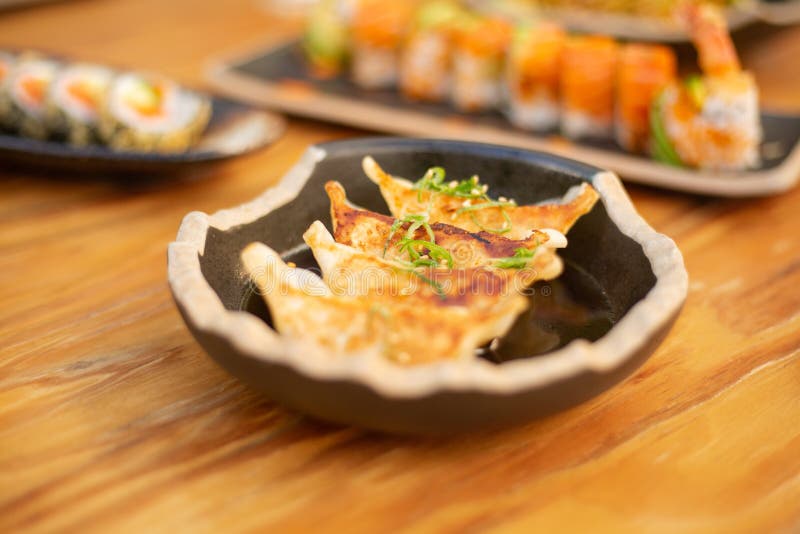 Two Girls Eating in a Sushi Restaurant in Summer Stock Image - Image of ...