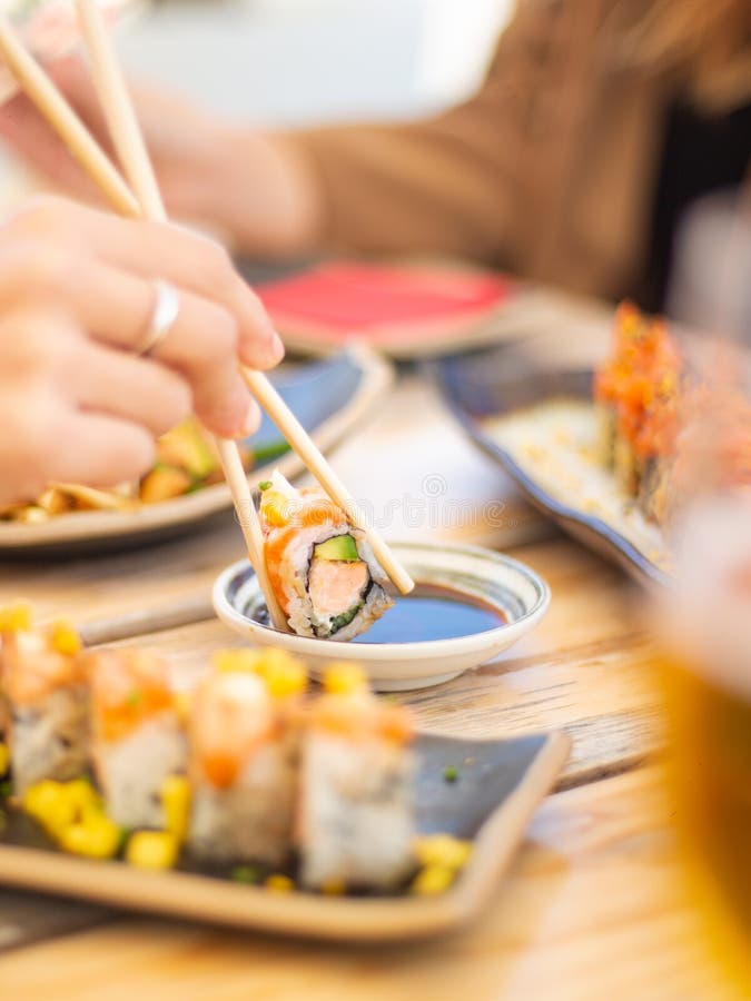 Two Girls Eating in a Sushi Restaurant in Summer Stock Photo - Image of ...