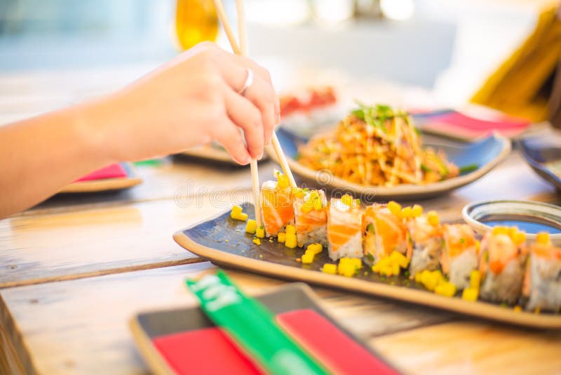 Two Girls Eating in a Sushi Restaurant in Summer Stock Photo - Image of ...