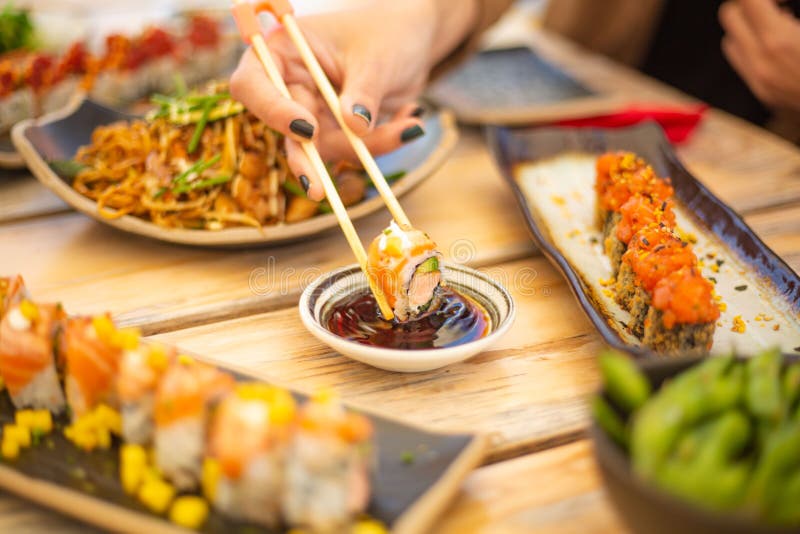 Two Girls Eating in a Sushi Restaurant in Summer Stock Image - Image of ...