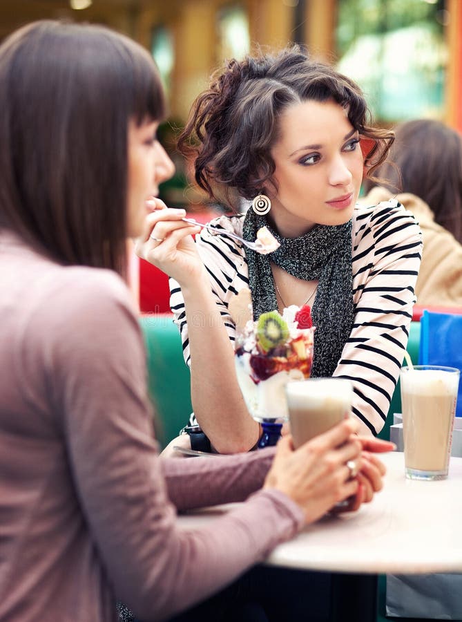 Two girls gossip stock photo. Image of adult, eating - 18597638