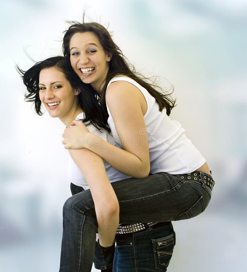 Two girls having fun stock image. Image of sitting, enjoyment - 5054959