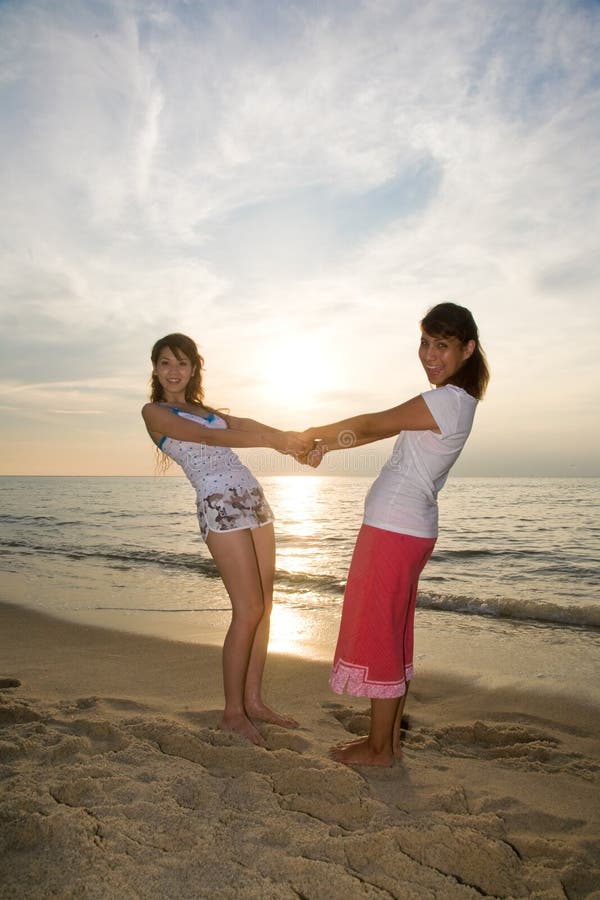 Two Girls Having Fun At The Beach Stock Image - Image of meditation ...