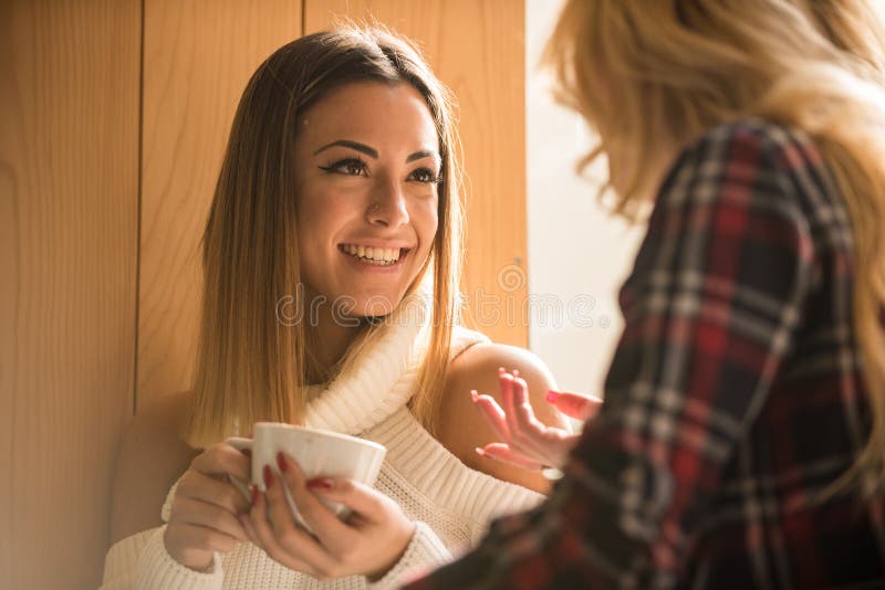 Two Girls Having Fun while Drinking Coffee Stock Photo - Image of ...
