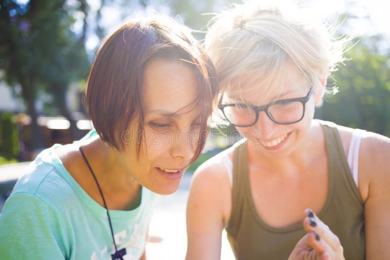 Two Girls Having Fun in the Park. Stock Image - Image of person, park ...