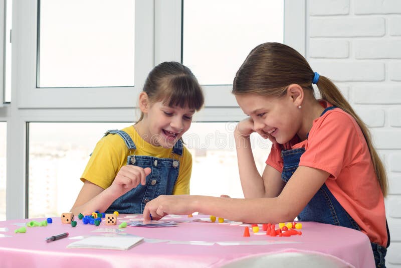 Two Girls Having Fun Playing a Board Game Stock Image - Image of ...