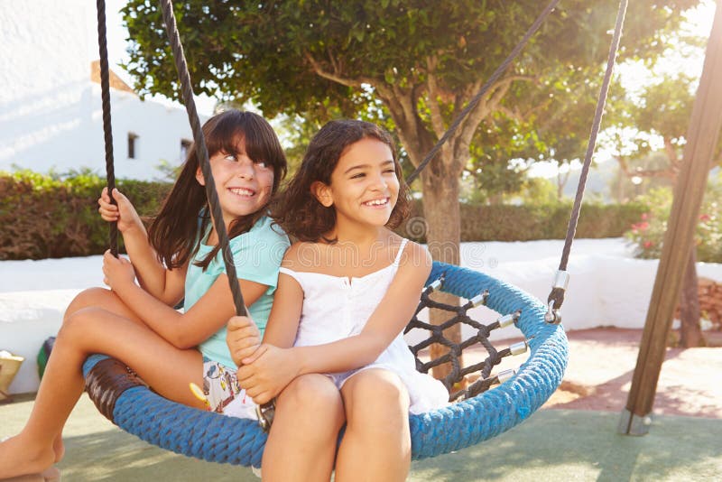 Two Girls Having Fun on Swing in Playground Stock Image - Image of ...