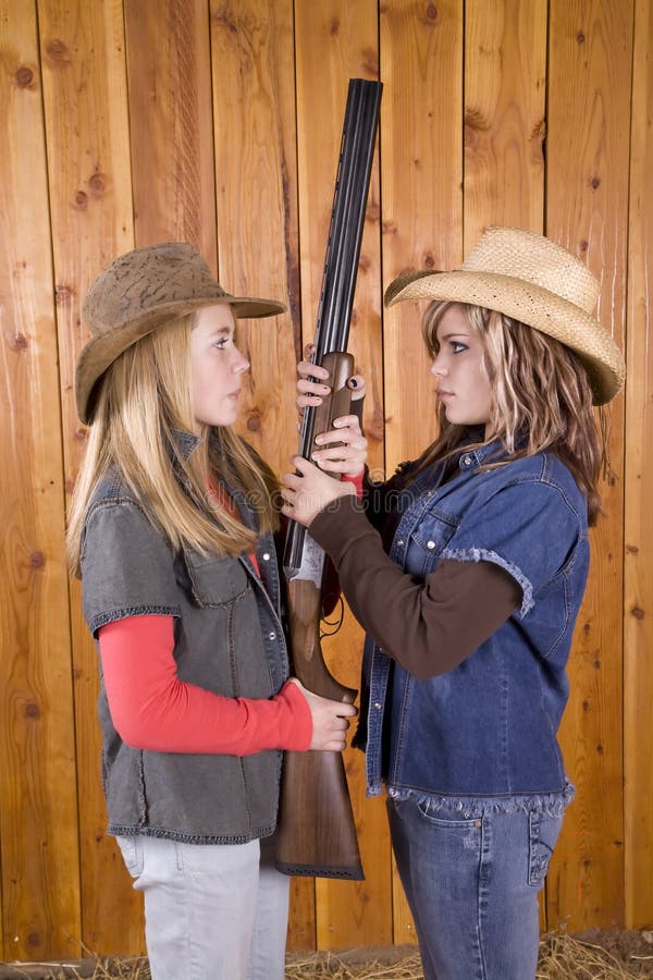 Two Girls Holding Shotgun Looking Each Other Stock Photos - Free ...