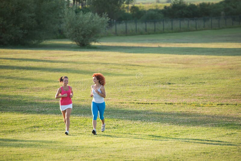 Two girls jogging stock photo. Image of lifestyle, lifestyles - 32973372