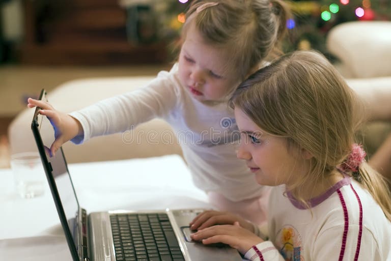 Two Girls and Laptop Computer Stock Photo - Image of entertaining ...