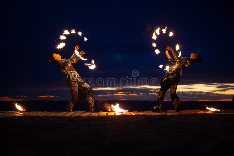 Two Girls Light a Sparkler on the Beach at Dusk Stock Image - Image of ...