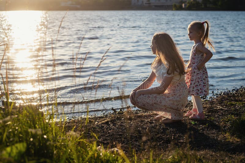 Two Girls Look into the Distance on the Shore Stock Image - Image of ...