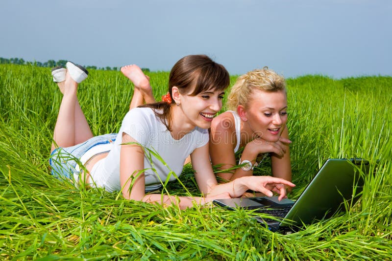 Two Girls Looking at Laptop Computer Stock Photo - Image of relaxed ...