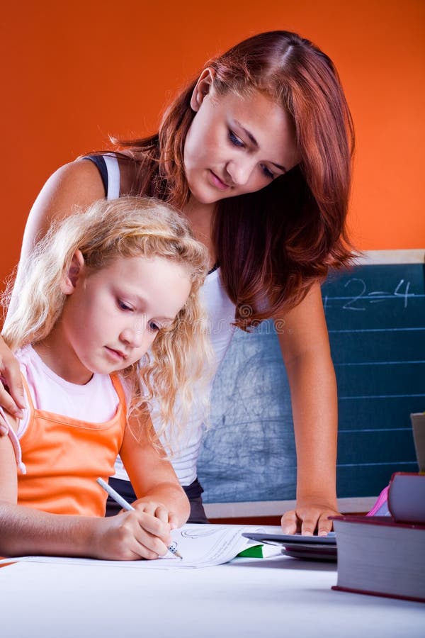 Two girls making homework stock photo. Image of teaching - 7500522