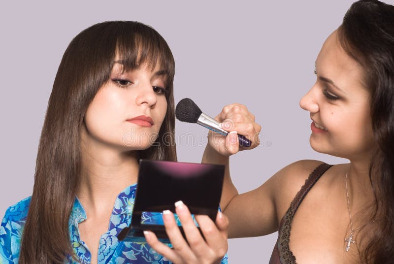 Two girls making up stock image. Image of fashionable - 21100335