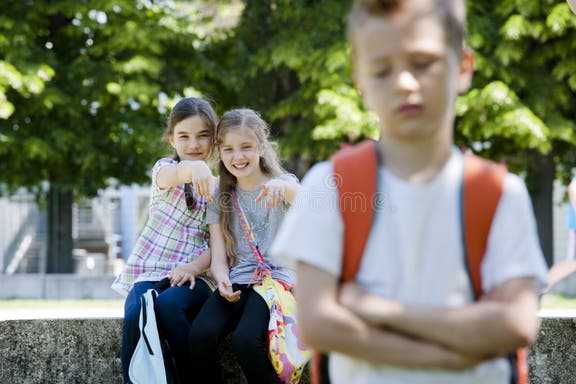 Two girls mocking a boy stock photo. Image of displeased - 25928416