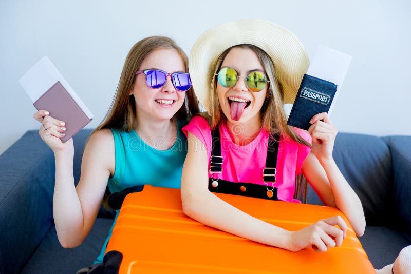 Two Girls Packing Suitcases Stock Photo - Image of room, journey: 95253616