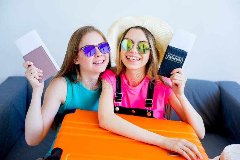 Two Girls Packing Suitcases Stock Photo - Image of young, passport ...