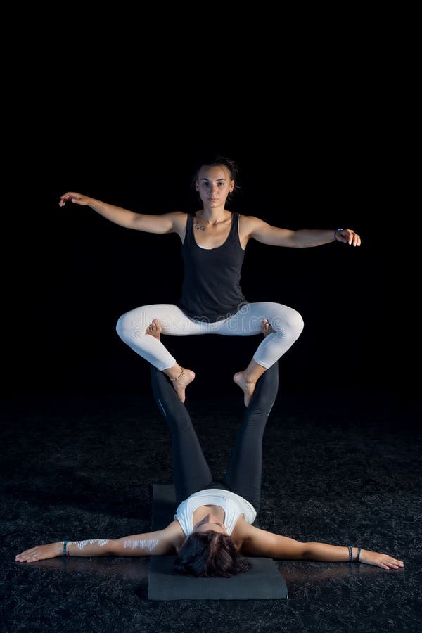 Two Girls Performing Acro-yoga Poses Stock Photo - Image of health ...
