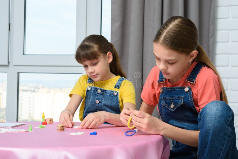 Two Girls Play Games at the Table Stock Image - Image of girls, library ...